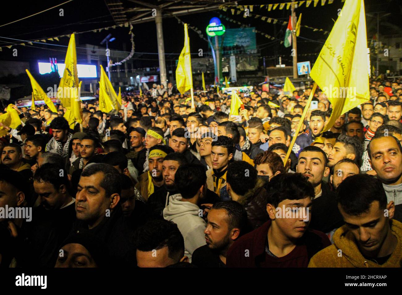 Palestinian Fatah supporters wave their yellow flags during a rally ...