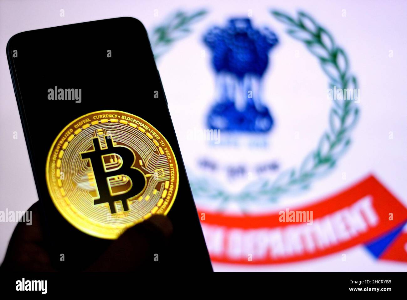 In this photo illustration a Bitcoin logo seen on a smartphone with an ...
