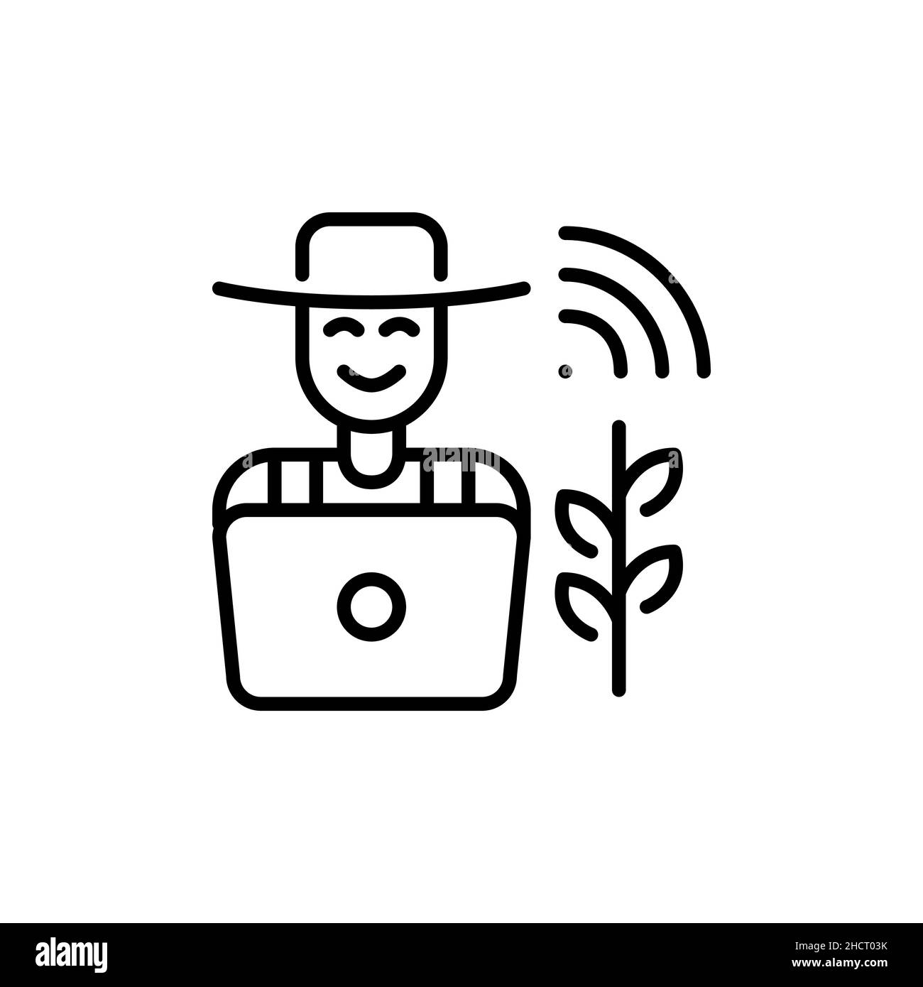 Modern smart farmer. Person wearing a hat and overalls at the computer ...