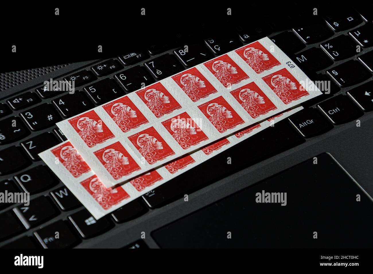 In this photo illustration post stamps seen displayed on a computer ...