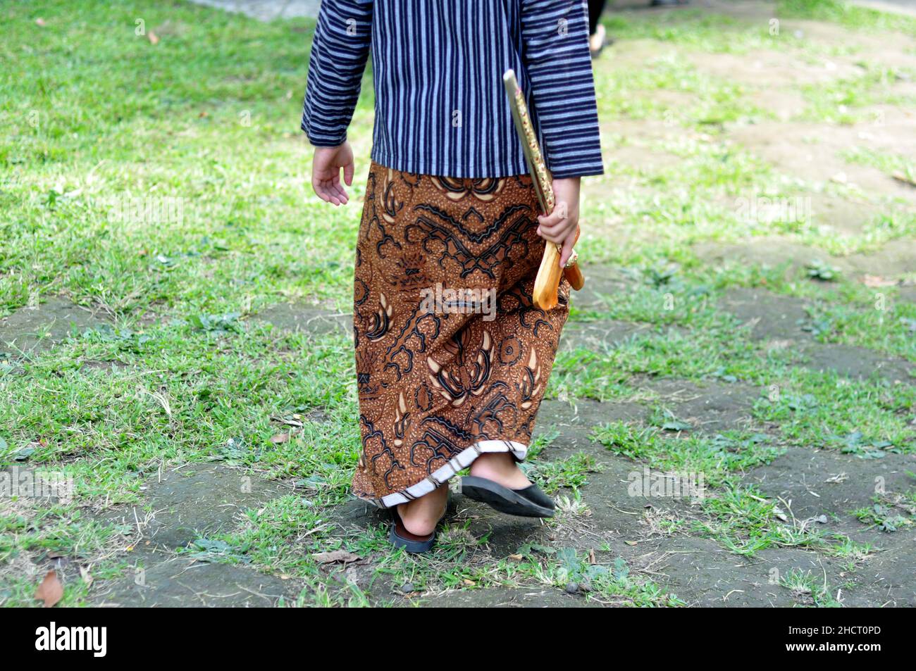 Yogyakarta, Indonesia - November 11, 2017: A boy wears traditional ...