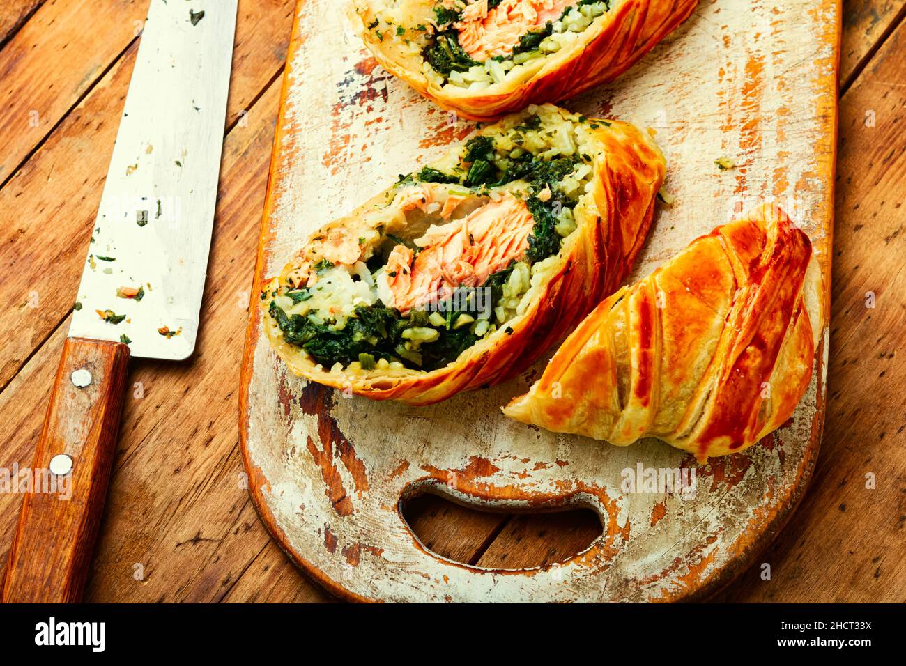 Tasty roll with salmon, rice and spinach. Fish pie. Fish wellington ...