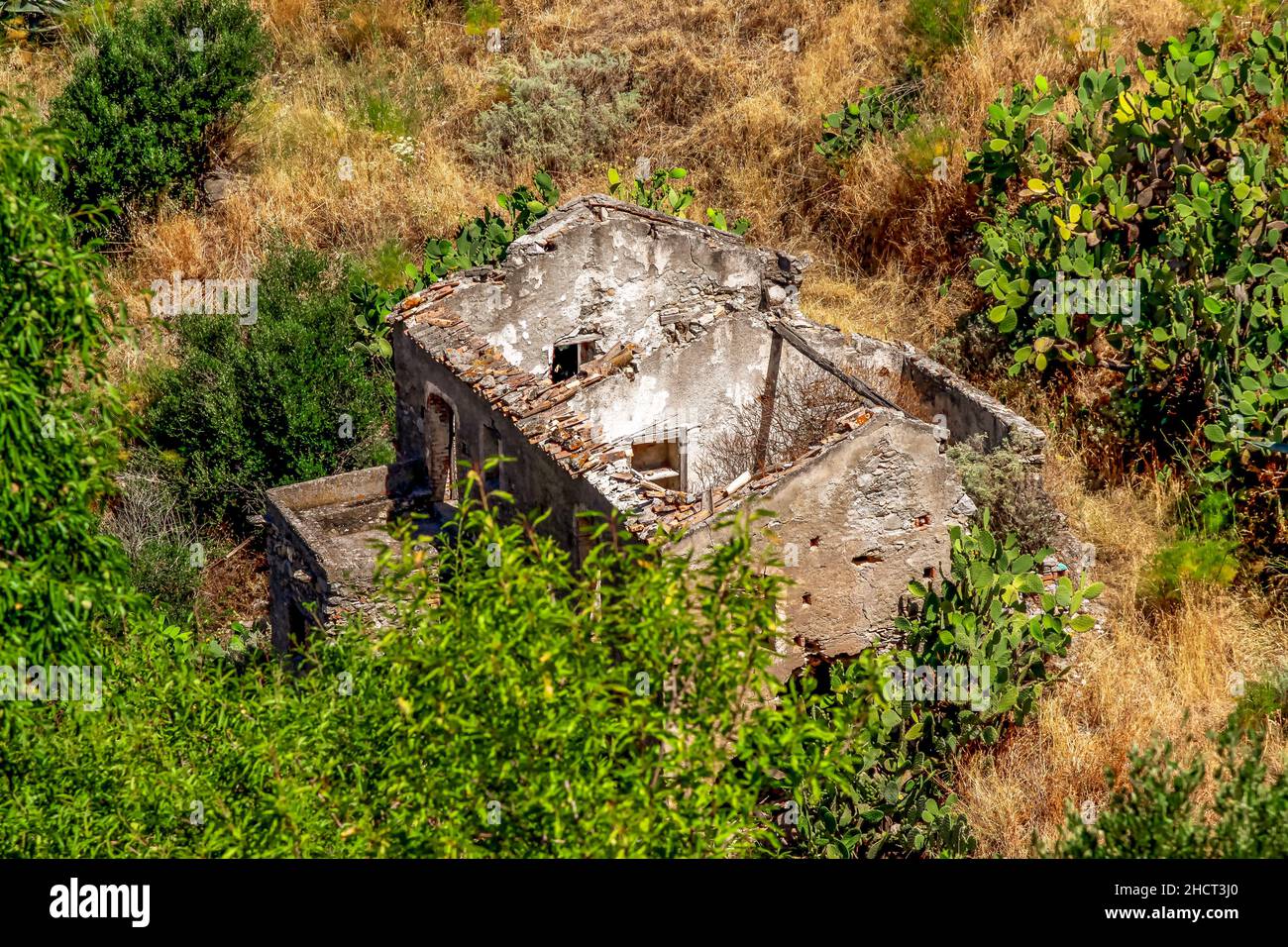 Small village of Pentedattilo, church and ruins of the abandoned ...