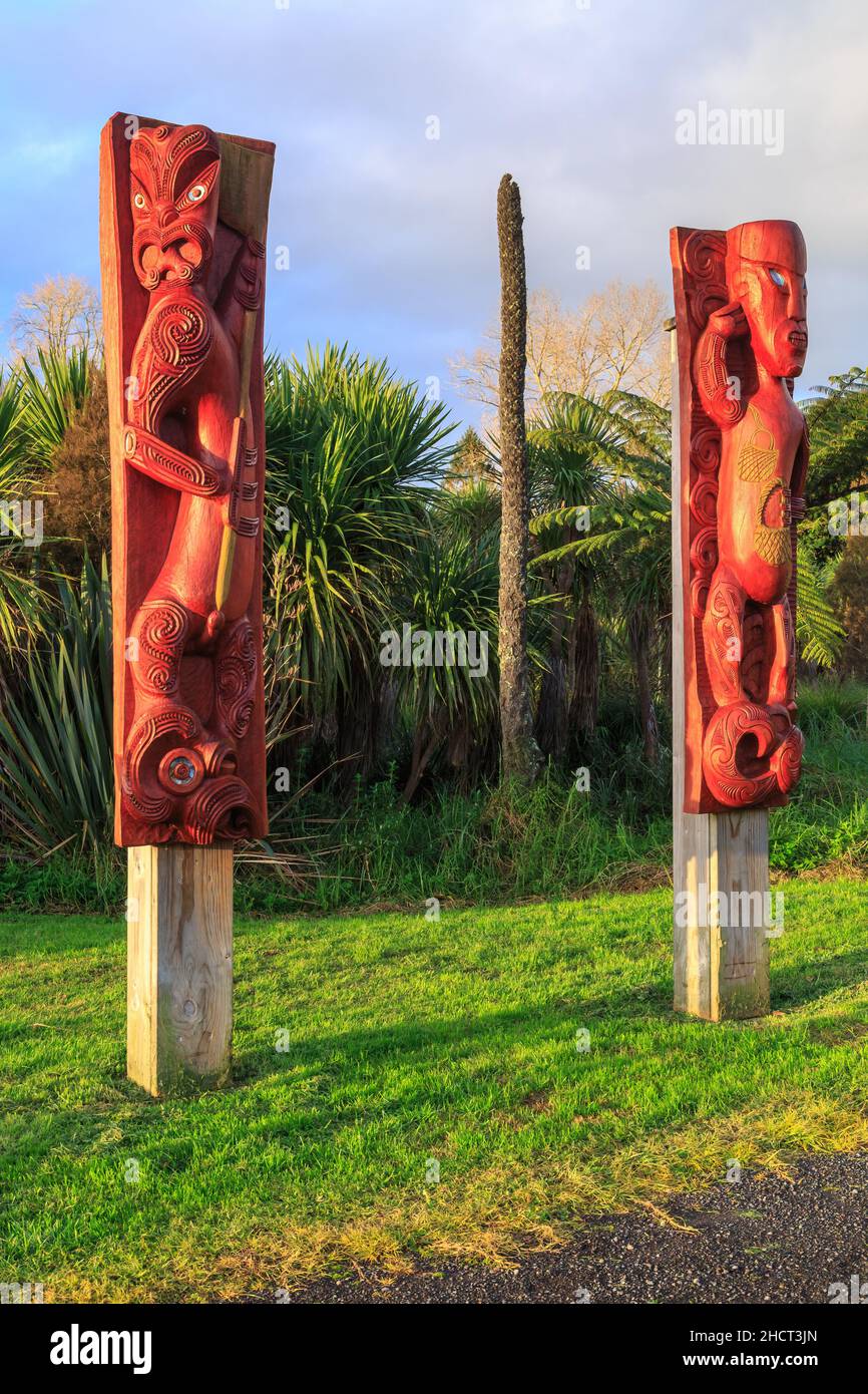 Maori carvings in Tauranga, New Zealand. They depict ancestral figures ...