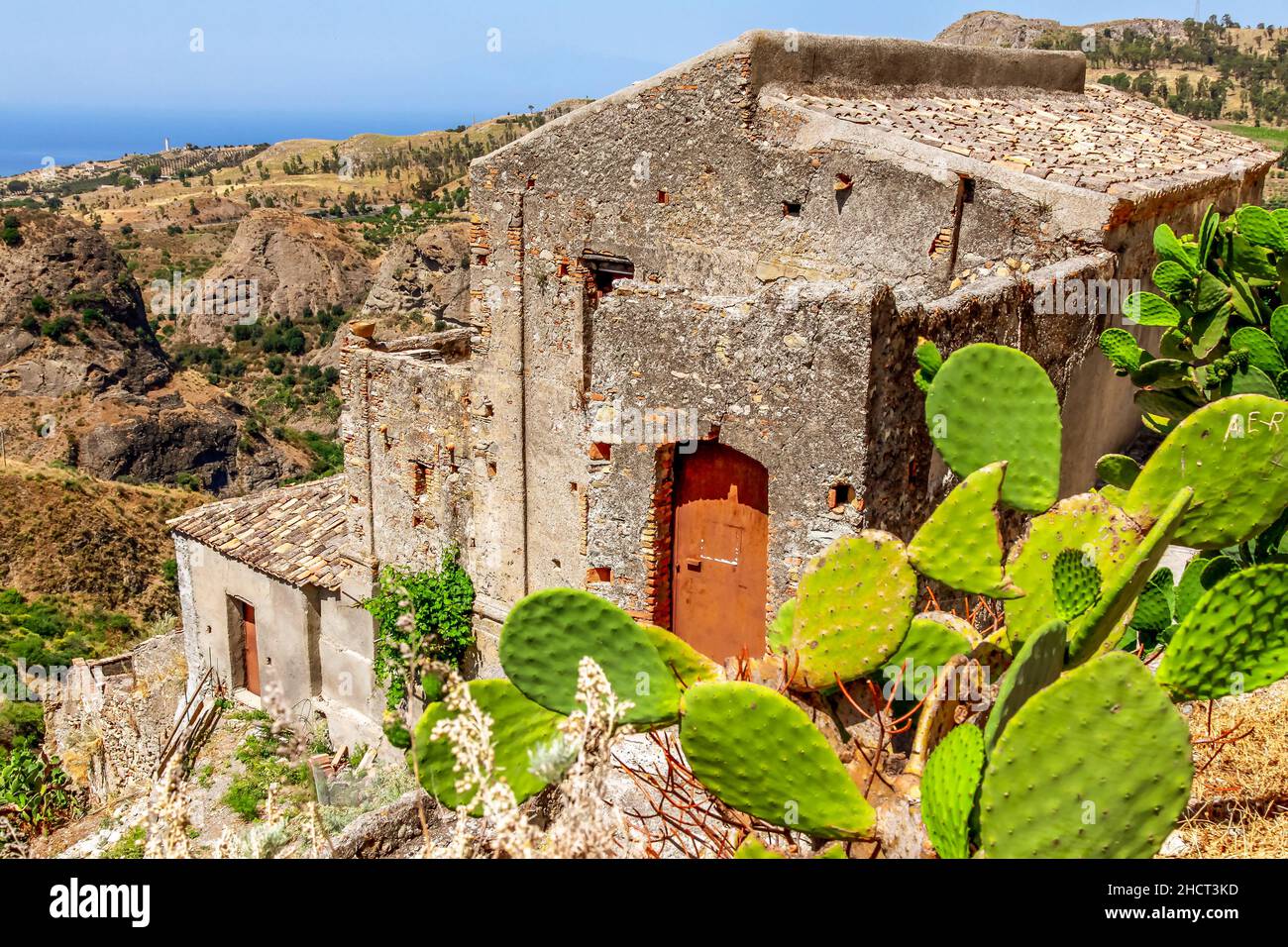 Small village of Pentedattilo, church and ruins of the abandoned ...