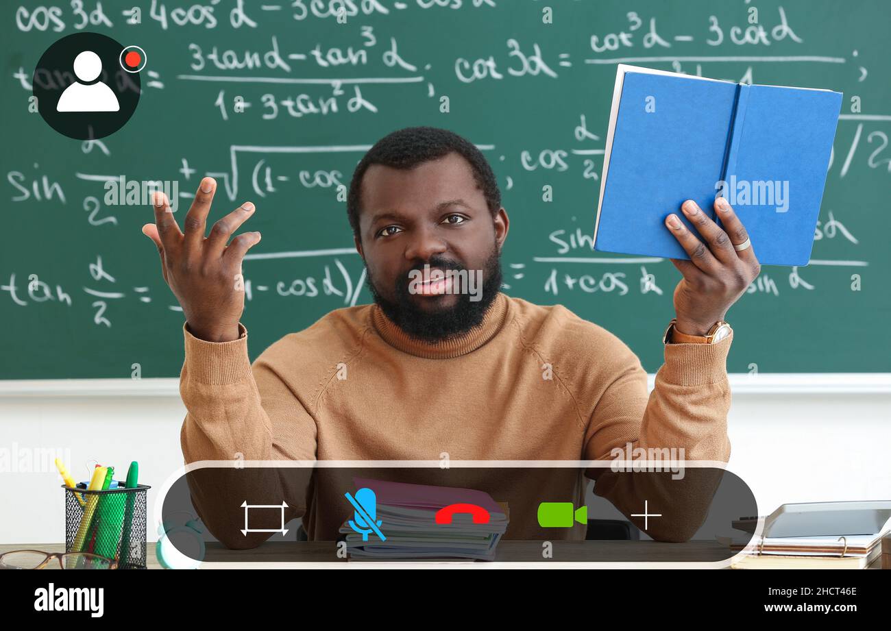 African-American male tutor conducting lesson online Stock Photo - Alamy