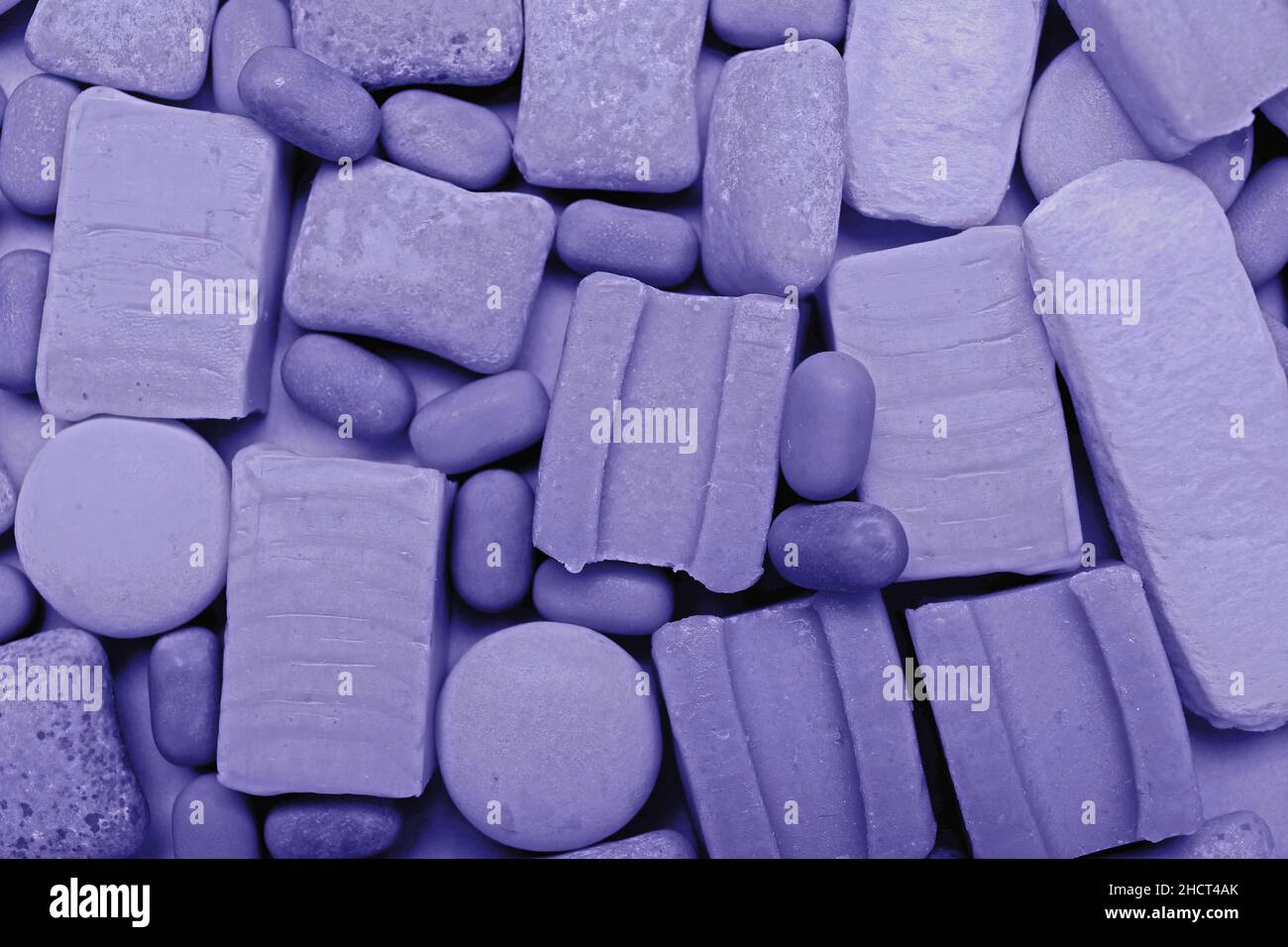 Different violet chewing gums as background Stock Photo - Alamy