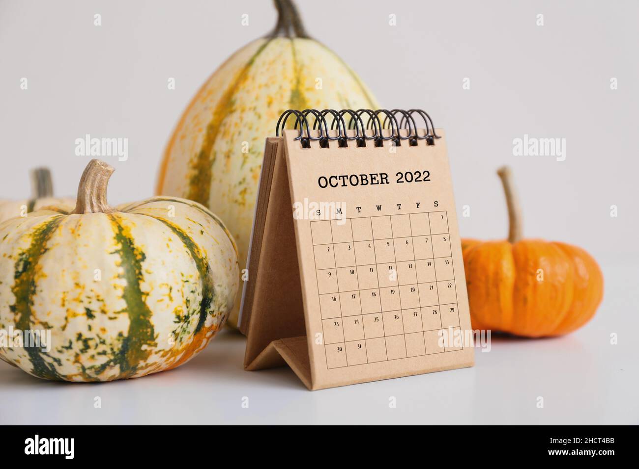 Craft calendar for October 2022 and pumpkins on light background Stock ...