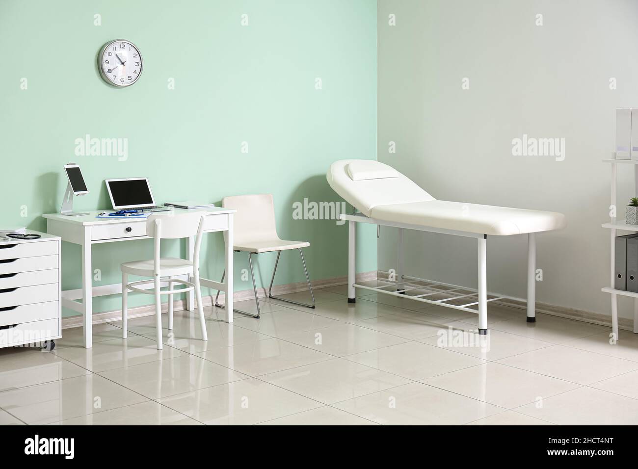 Interior of doctor's office with modern workplace and medical couch ...