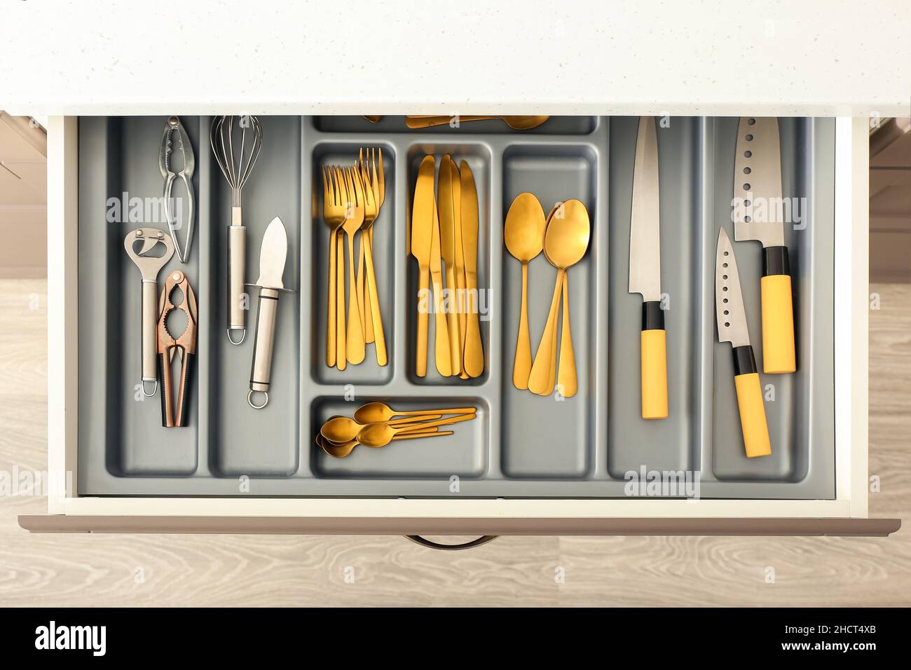 Open drawer with cutlery and utensils in kitchen, closeup Stock Photo ...