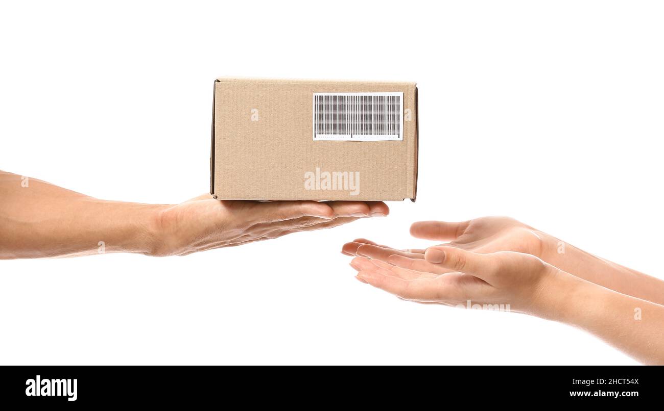 Courier giving parcel to customer on white background, view of hands ...