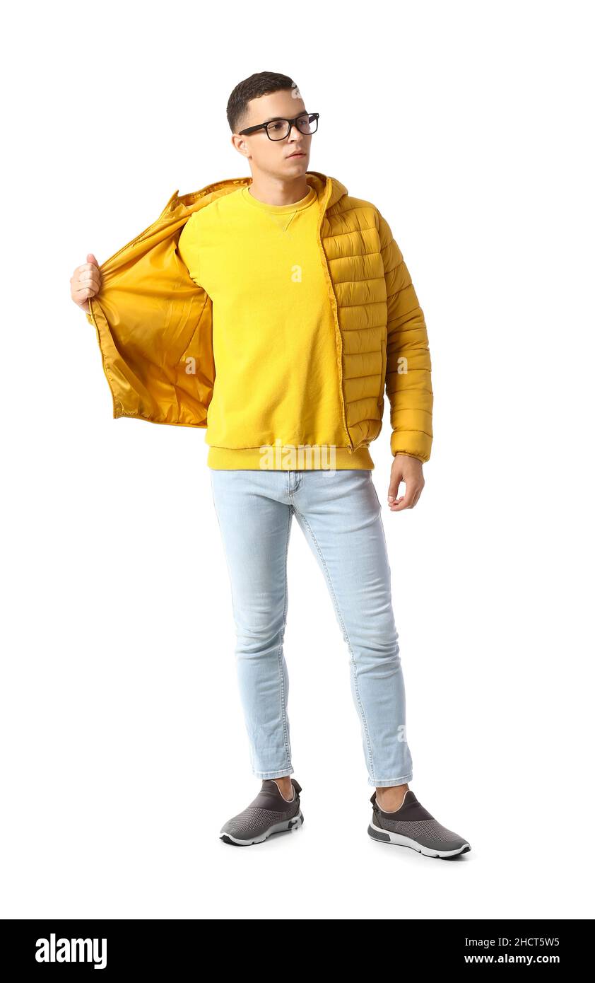 Young man in yellow jacket and sweatshirt on white background Stock ...