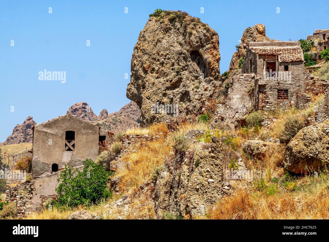 Small village of Pentedattilo, church and ruins of the abandoned ...