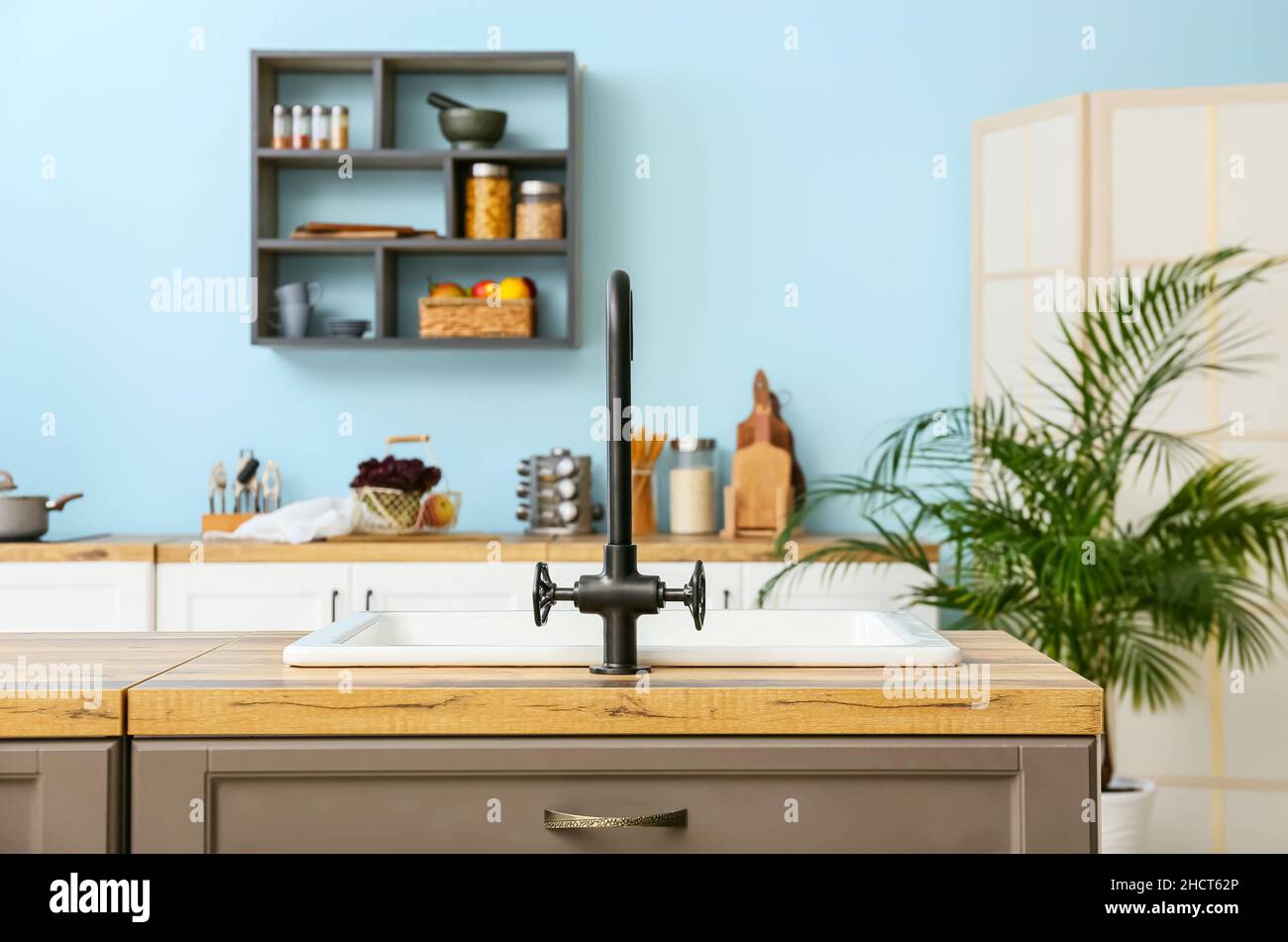 Stylish counter with sink in kitchen Stock Photo - Alamy