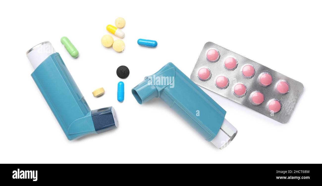 Asthma inhalers and tablets on white background Stock Photo - Alamy