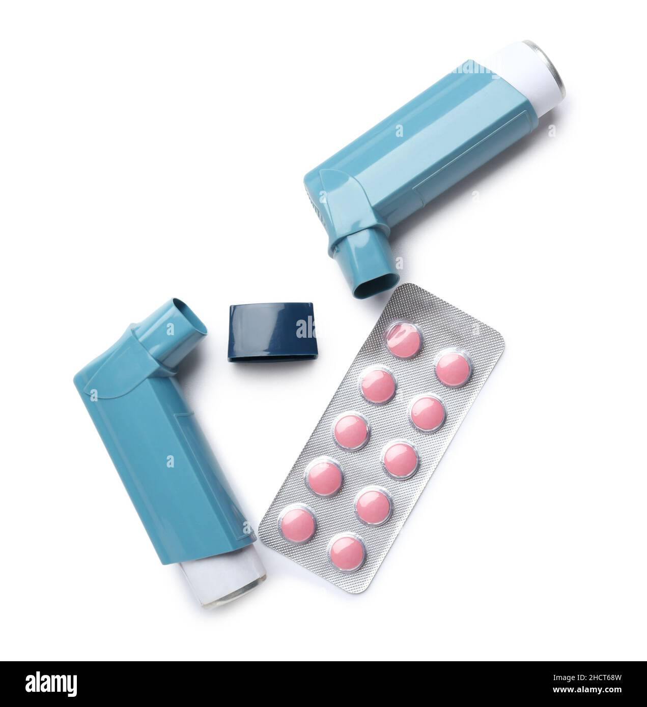 Modern asthma inhalers and blister pack of pills on white background ...