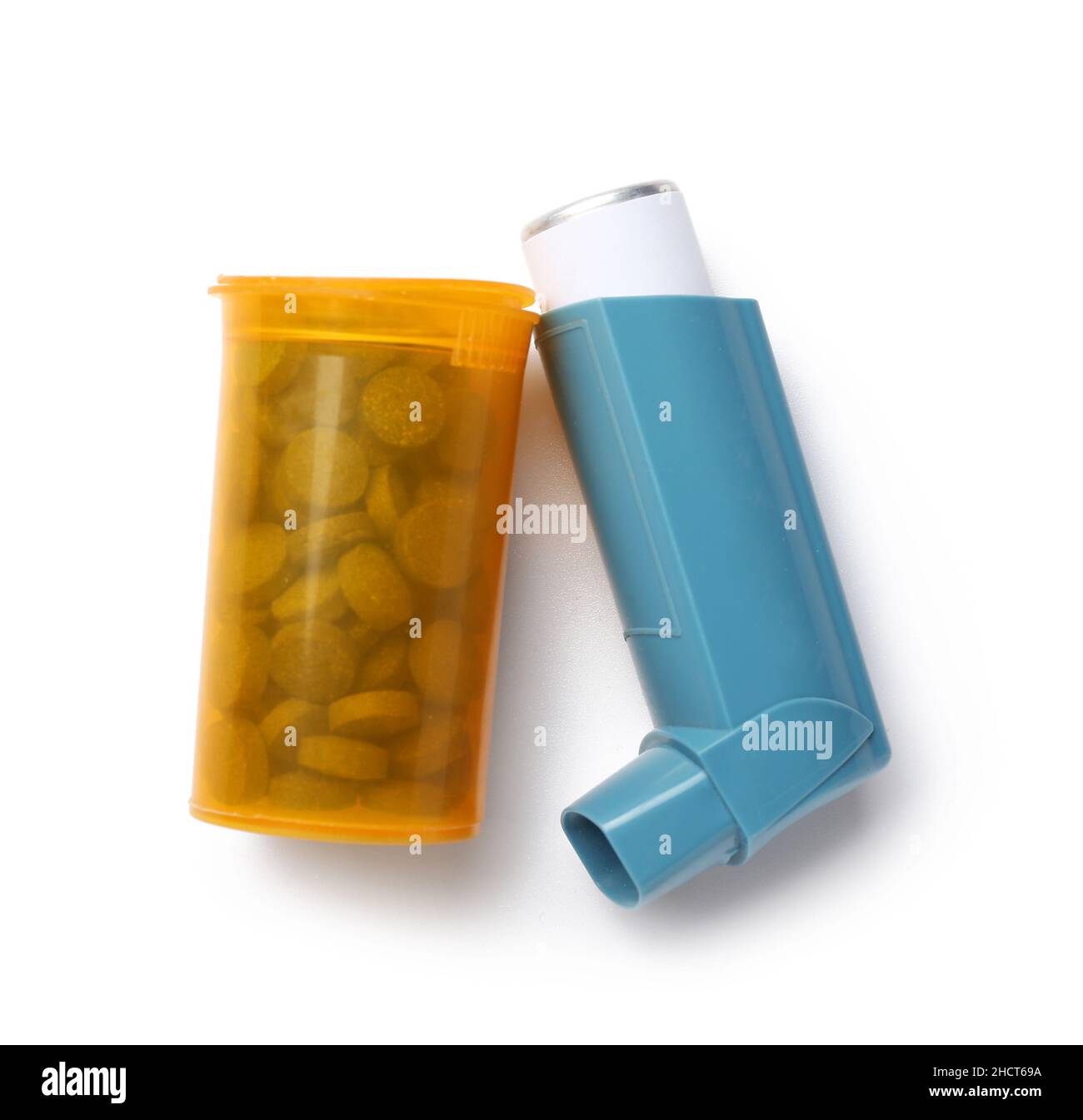 Asthma inhaler and jar of pills on white background Stock Photo - Alamy