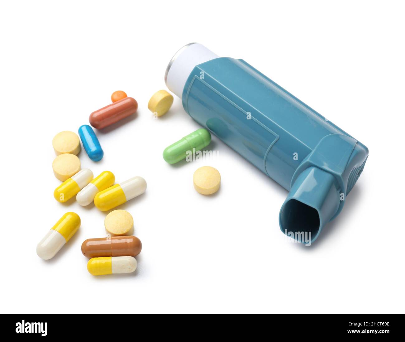 Modern asthma inhaler and different pills on white background Stock ...