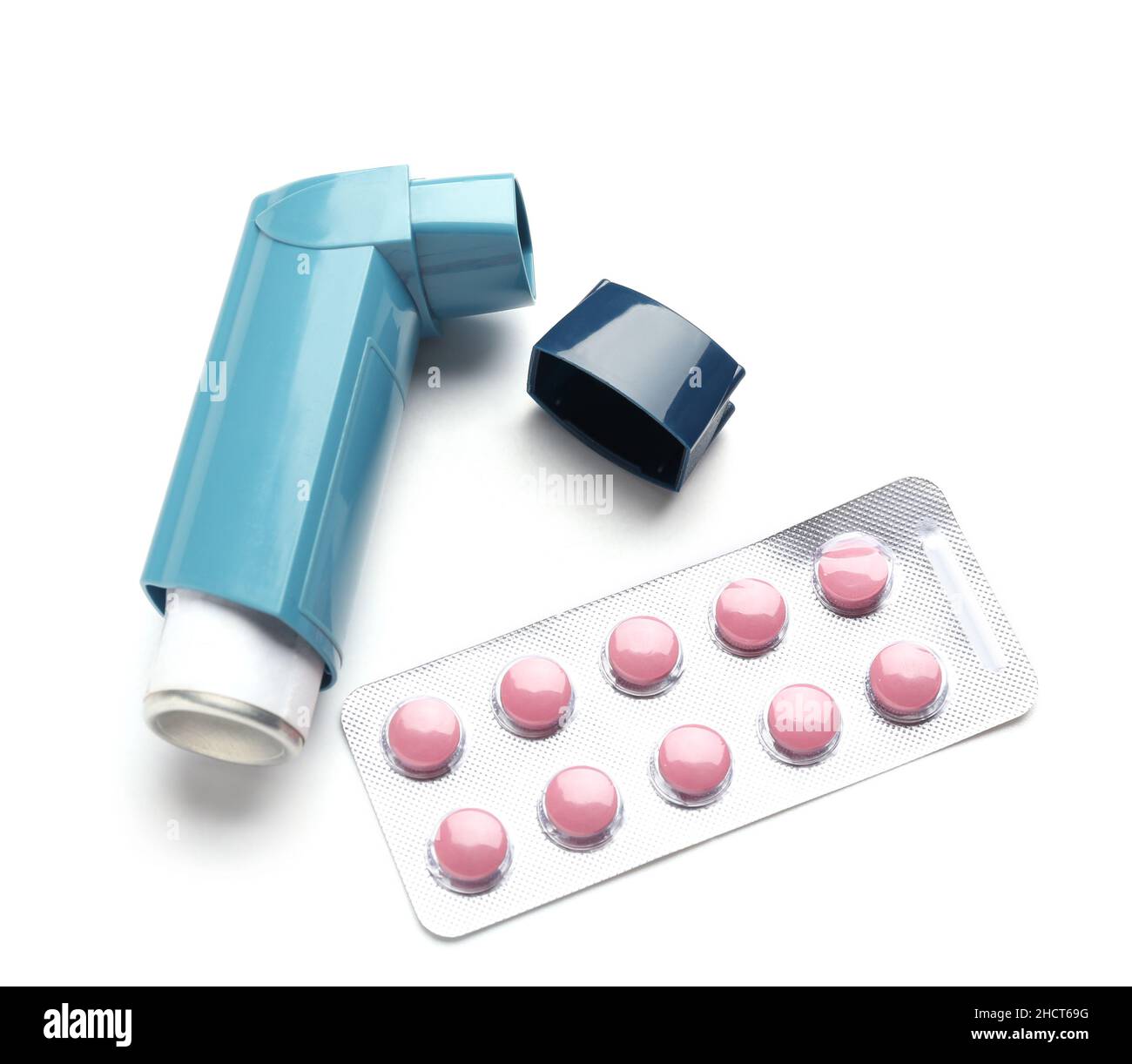 Modern asthma inhaler and blister pack of pills on white background ...
