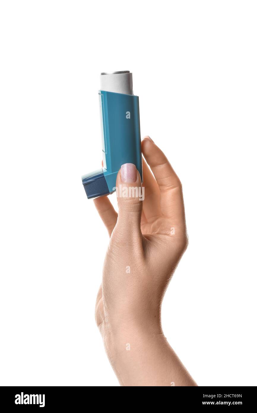Woman holding modern asthma inhaler on white background Stock Photo - Alamy