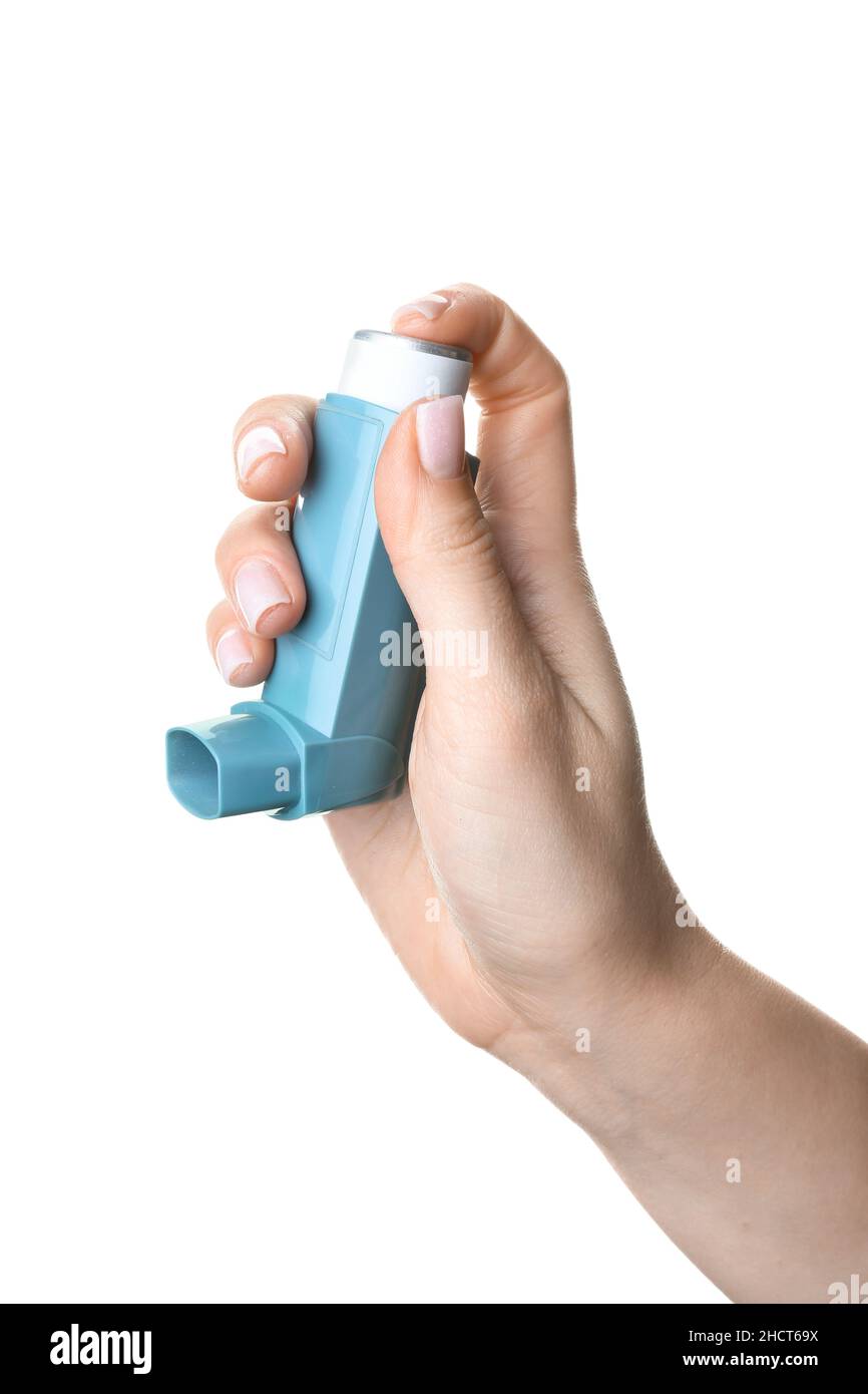 Female hand with modern asthma inhaler on white background Stock Photo ...