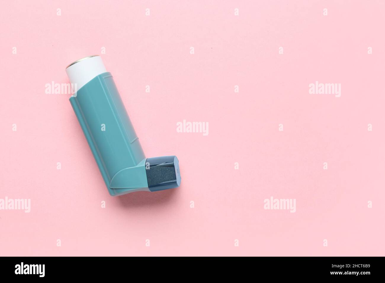 Modern asthma inhaler on color background Stock Photo - Alamy