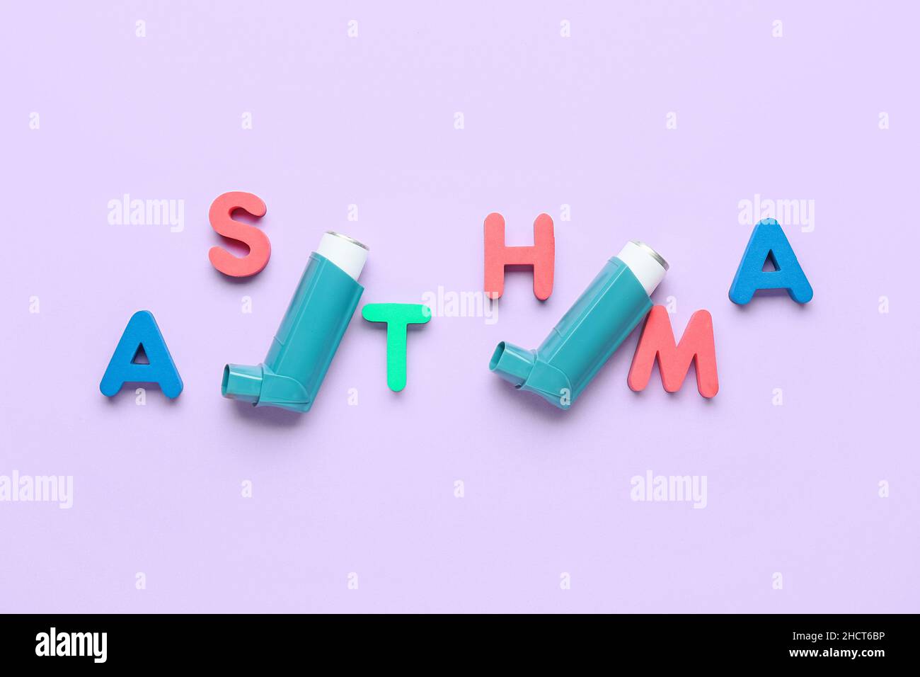 Modern inhaler and word ASTHMA on color background Stock Photo - Alamy