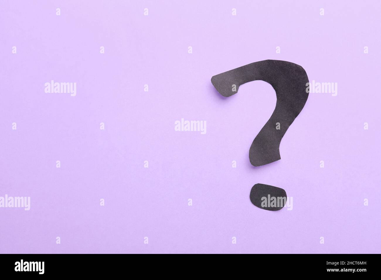 Question mark made of black paper on lilac background Stock Photo - Alamy