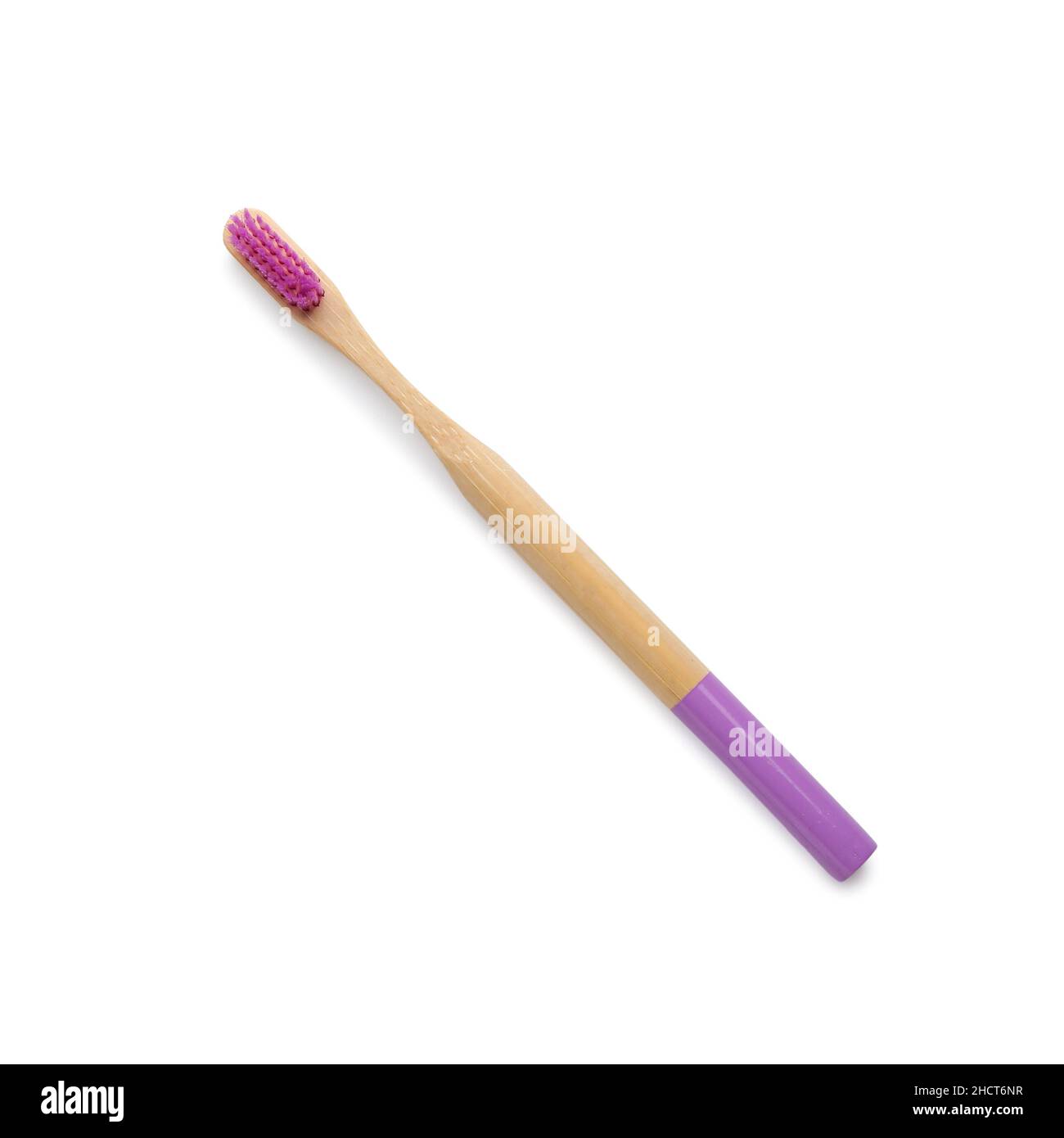Purple bamboo toothbrush on white background Stock Photo - Alamy