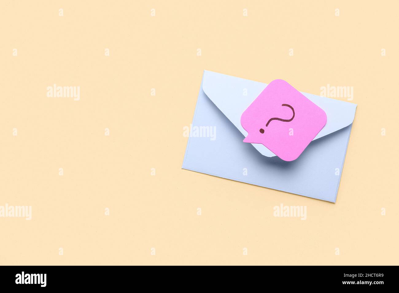 Sticky note with question mark and envelope on beige background Stock ...