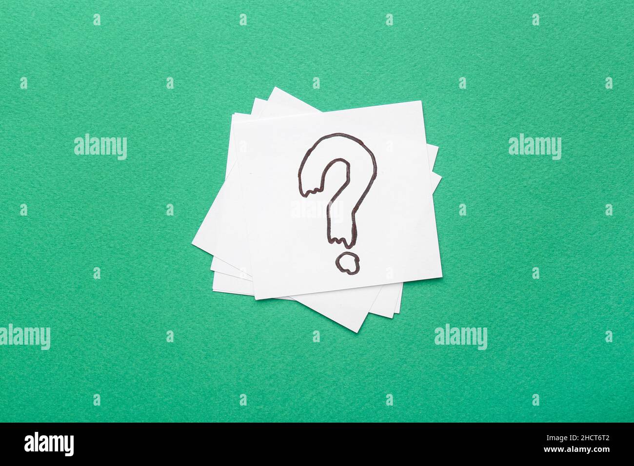 White sticky notes with question mark on green background Stock Photo ...