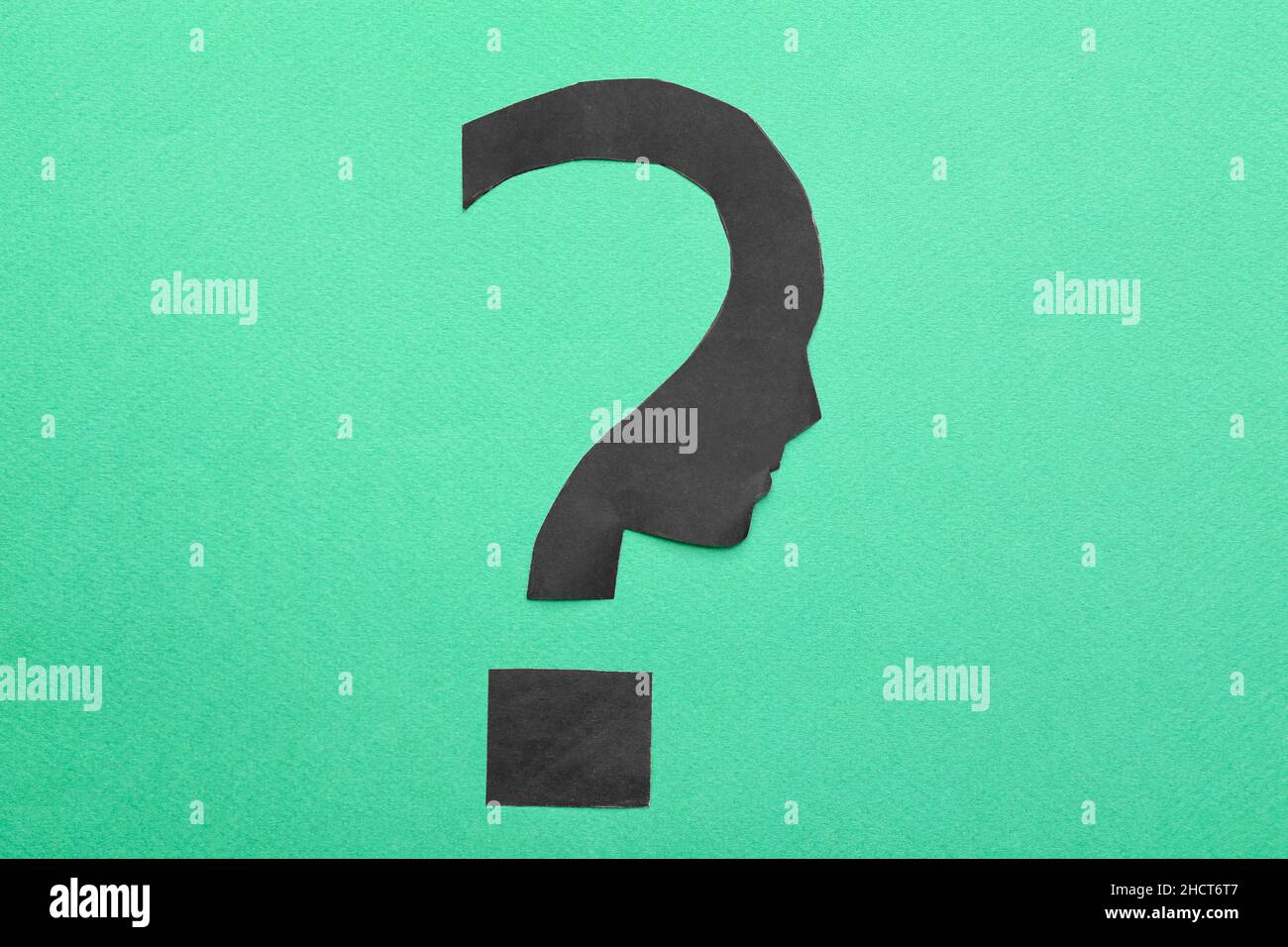 Question mark made of black paper on green background Stock Photo - Alamy