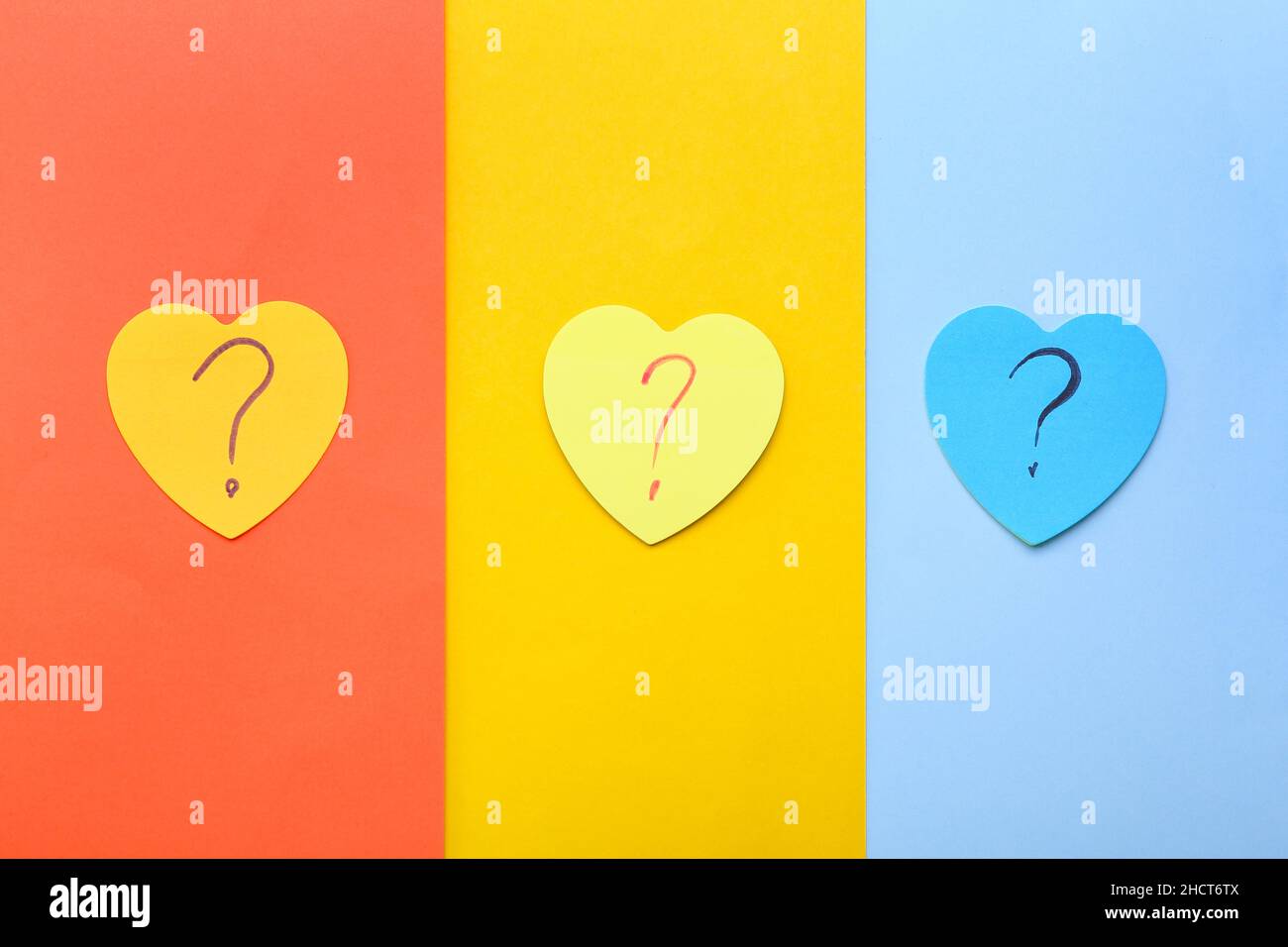 Heart shaped sticky notes with question marks on color background Stock ...