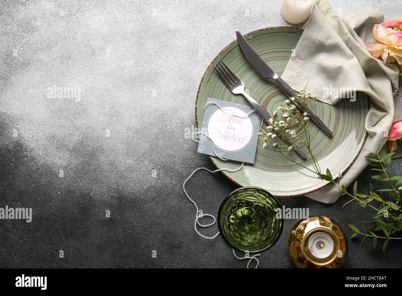 Beautiful table setting with wedding invitation on grunge background ...