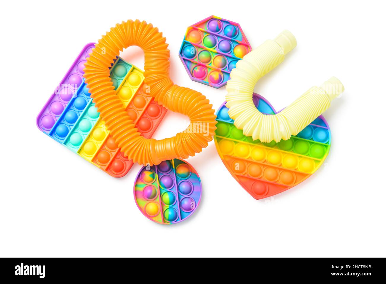Colorful Pop Tubes and Pop it fidget toys on white background Stock ...