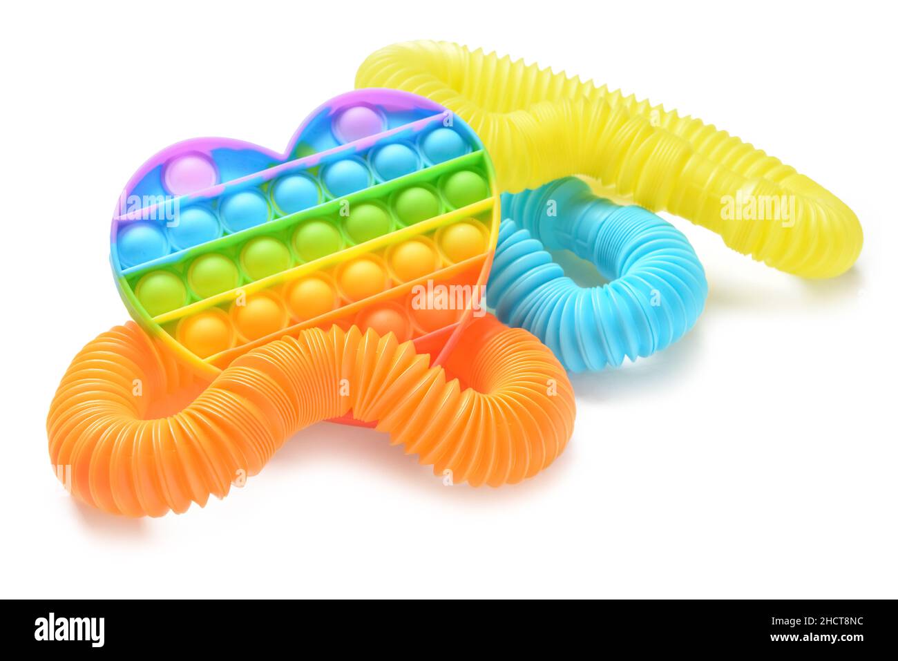 Colorful Pop Tubes and Pop it fidget toy on white background Stock ...