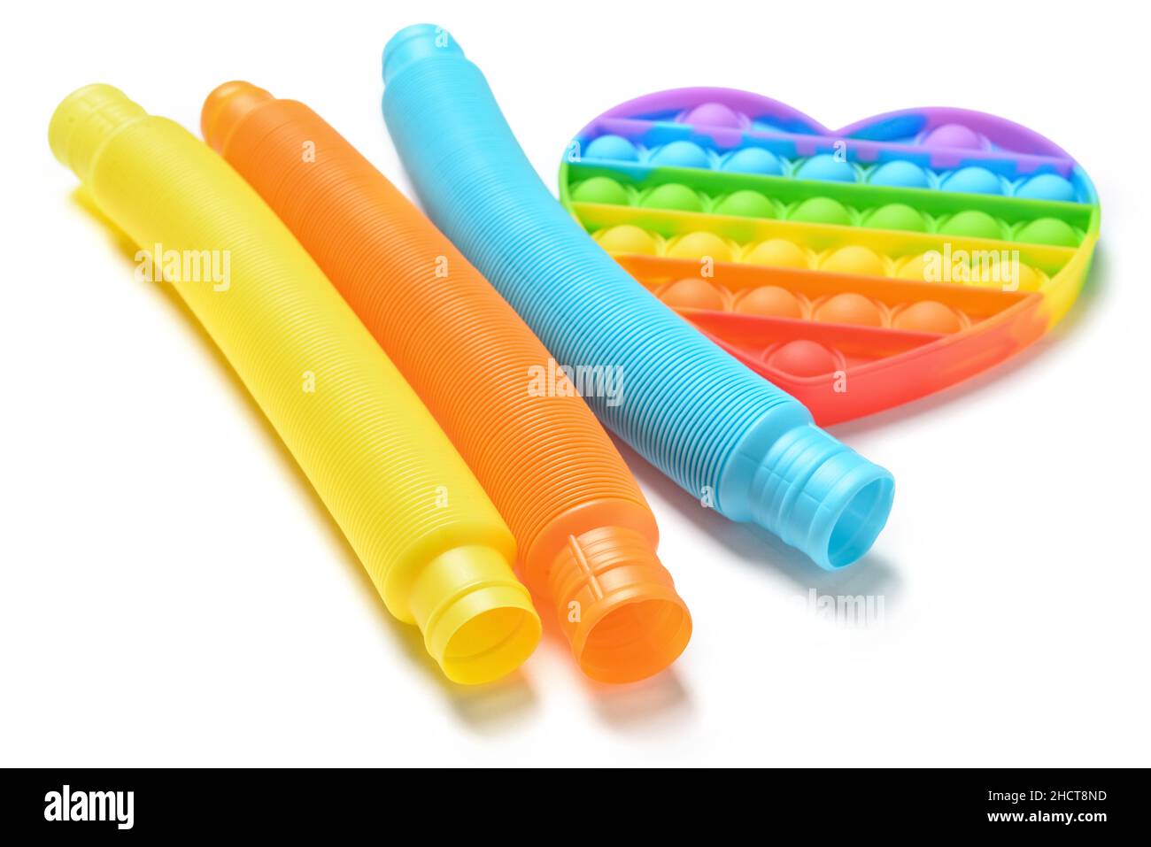 Colorful Pop Tubes and Pop it fidget toy on white background Stock ...
