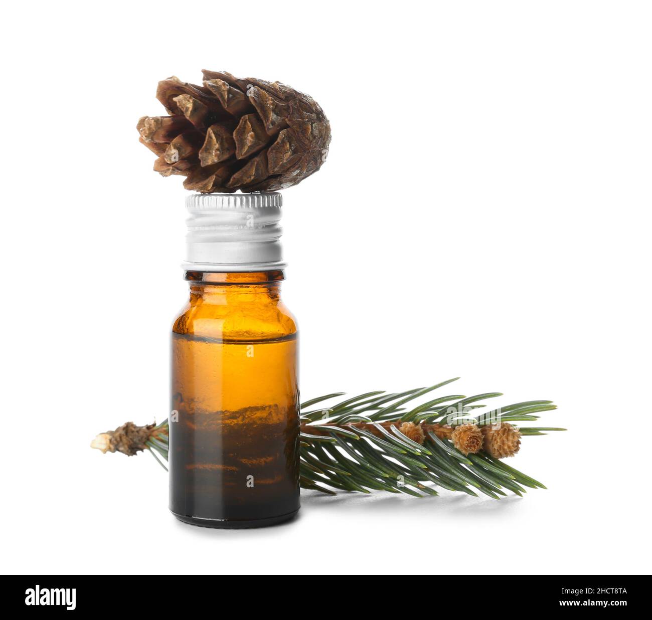 Bottle of essential oil, fir branch and cone on white background Stock ...