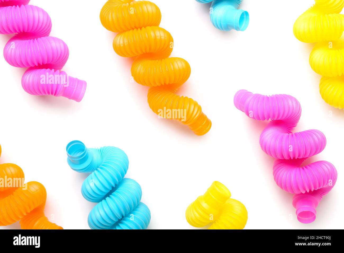 Different colorful Pop Tubes on white background Stock Photo - Alamy