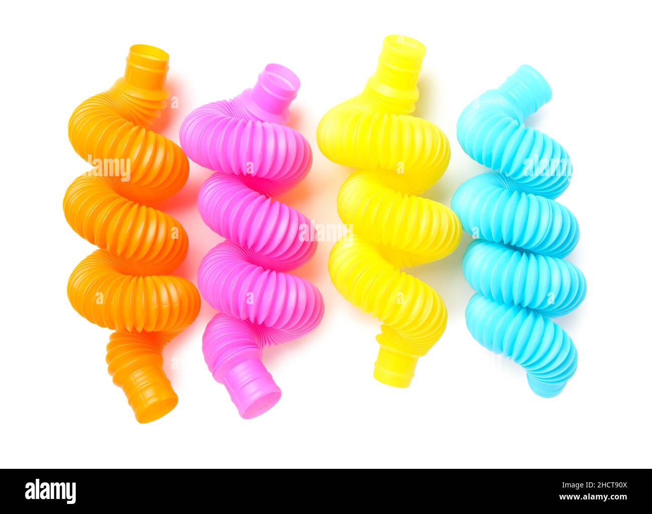 Different colorful Pop Tubes on white background Stock Photo - Alamy
