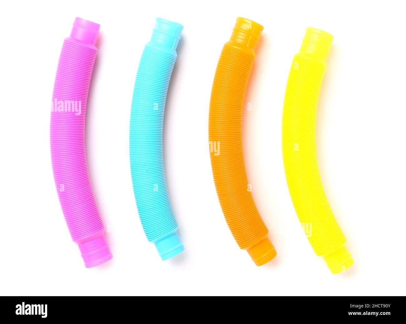 Different colorful Pop Tubes on white background Stock Photo - Alamy