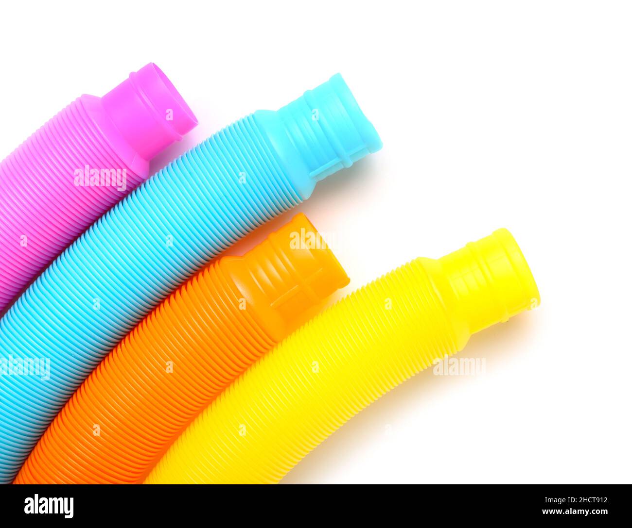 Different colorful Pop Tubes on white background Stock Photo - Alamy