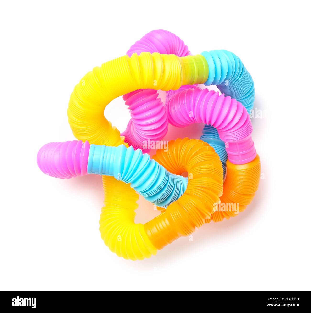 Different colorful Pop Tubes on white background Stock Photo - Alamy