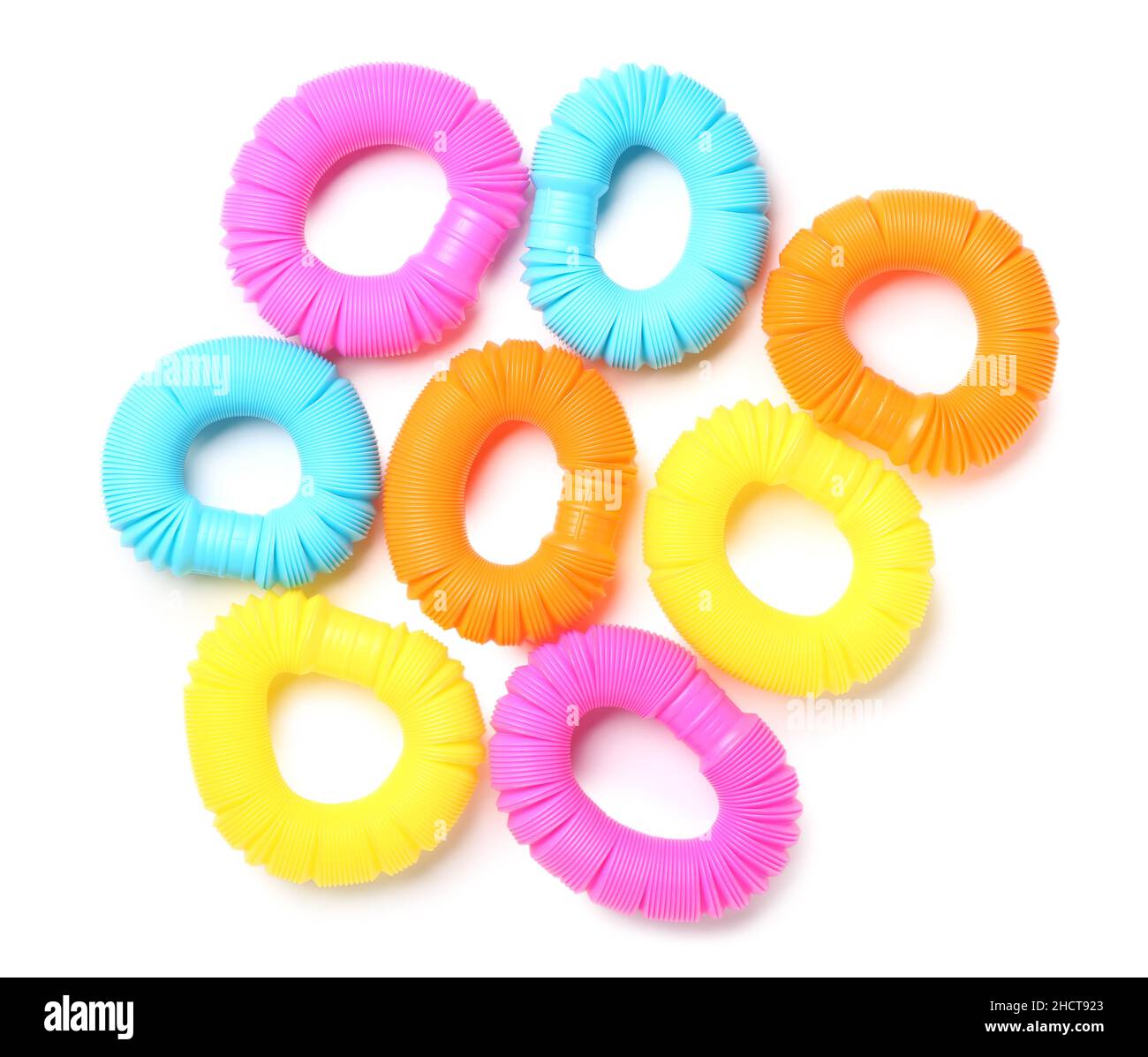 Different colorful Pop Tubes on white background Stock Photo - Alamy