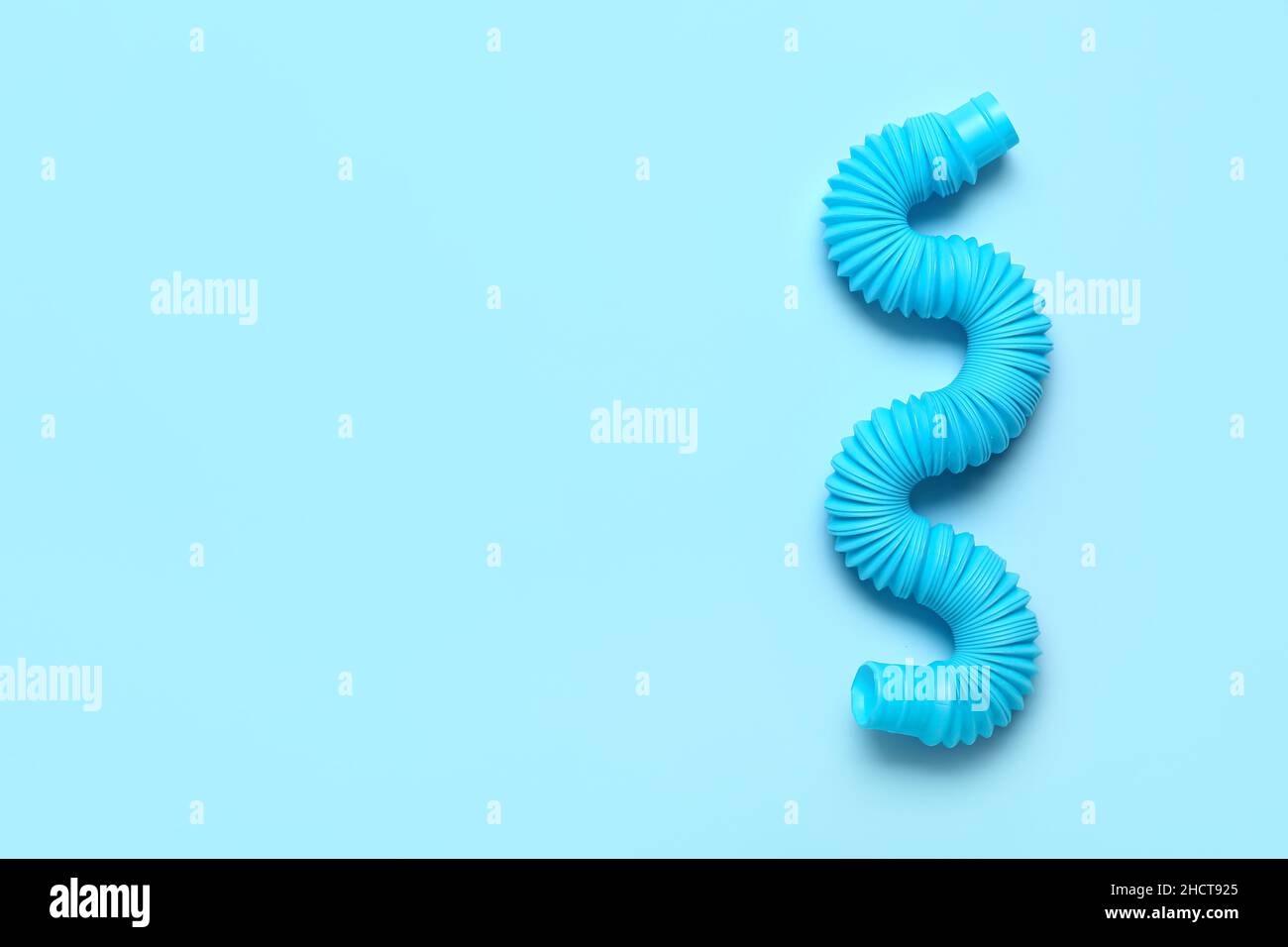 Pop Tube on blue background Stock Photo - Alamy