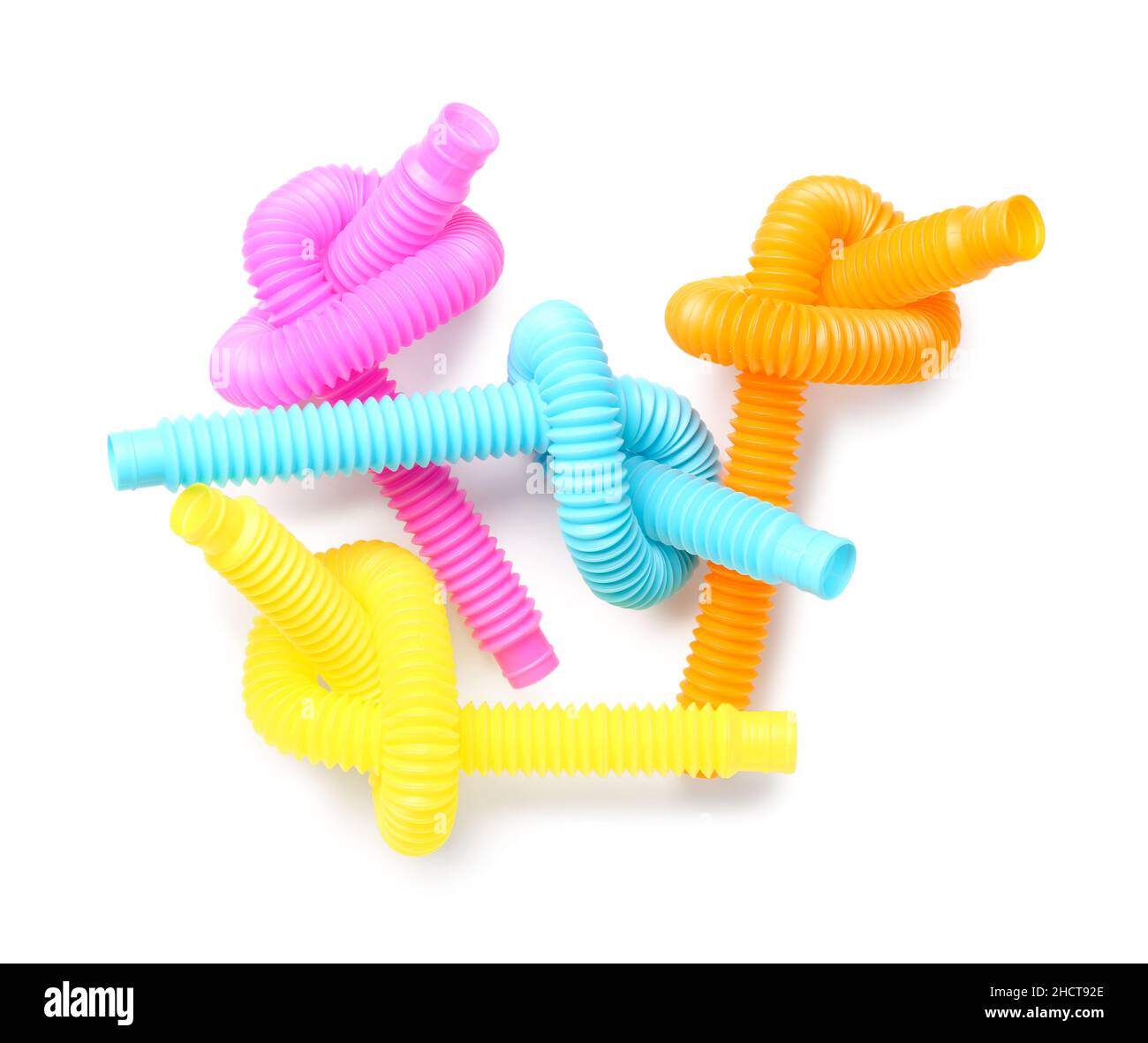 Different colorful Pop Tubes on white background Stock Photo - Alamy
