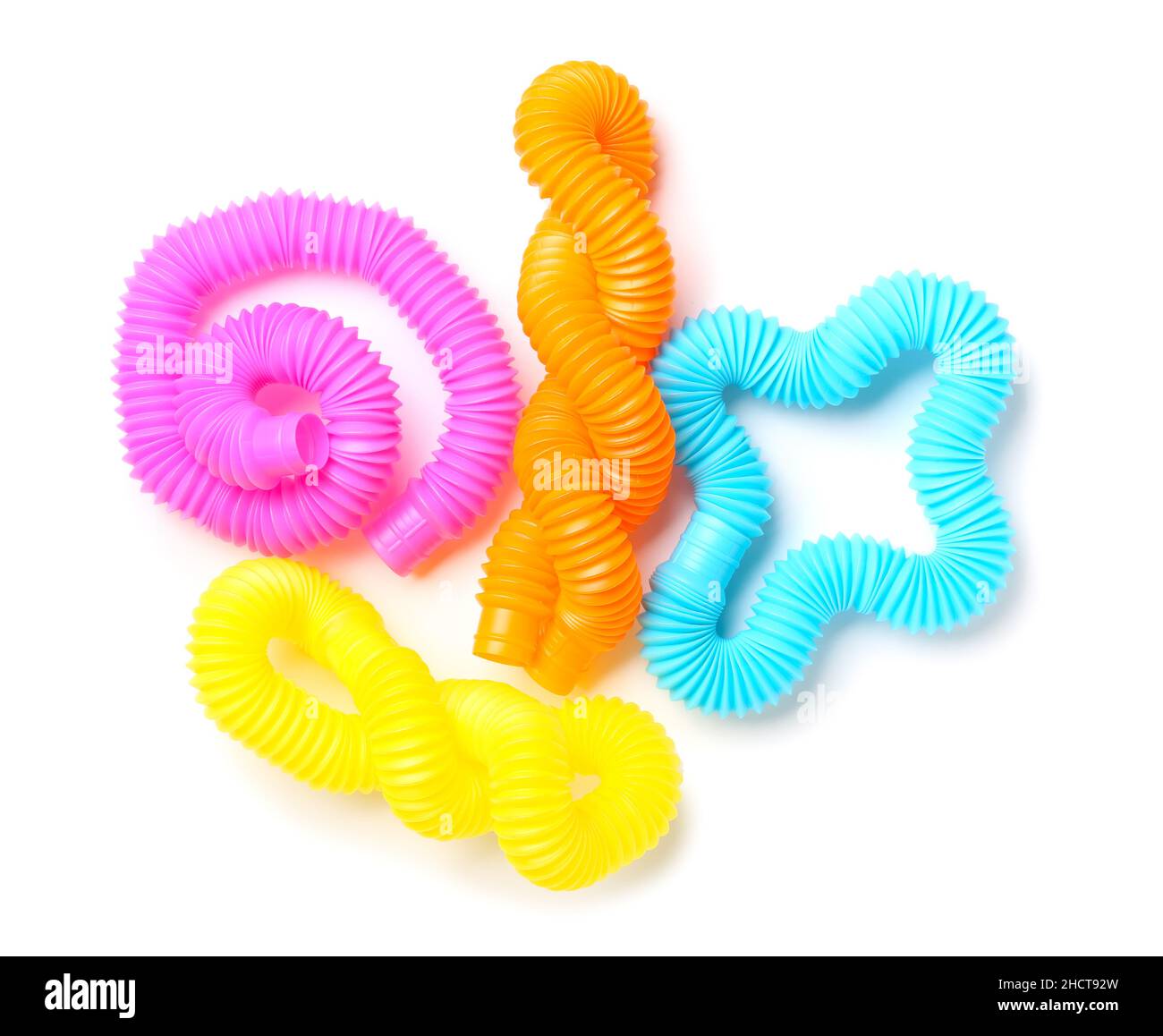 Different colorful Pop Tubes on white background Stock Photo - Alamy