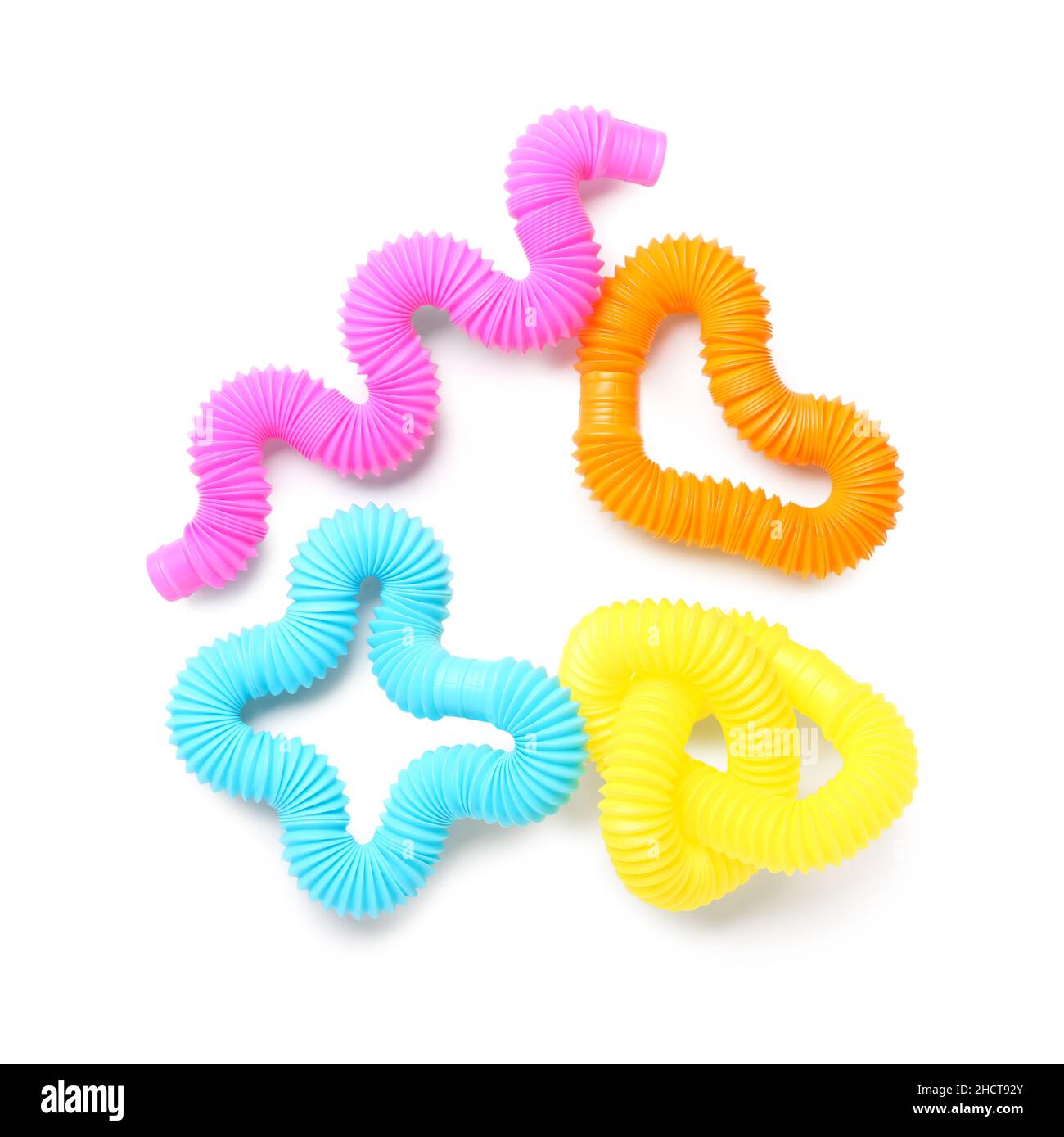 Different colorful Pop Tubes on white background Stock Photo - Alamy