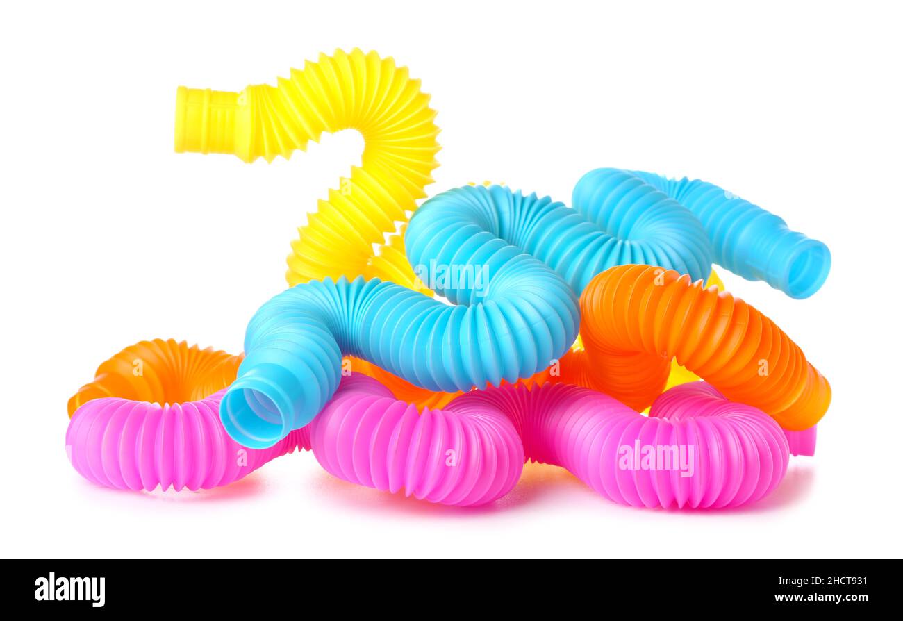 Different colorful Pop Tubes on white background Stock Photo - Alamy