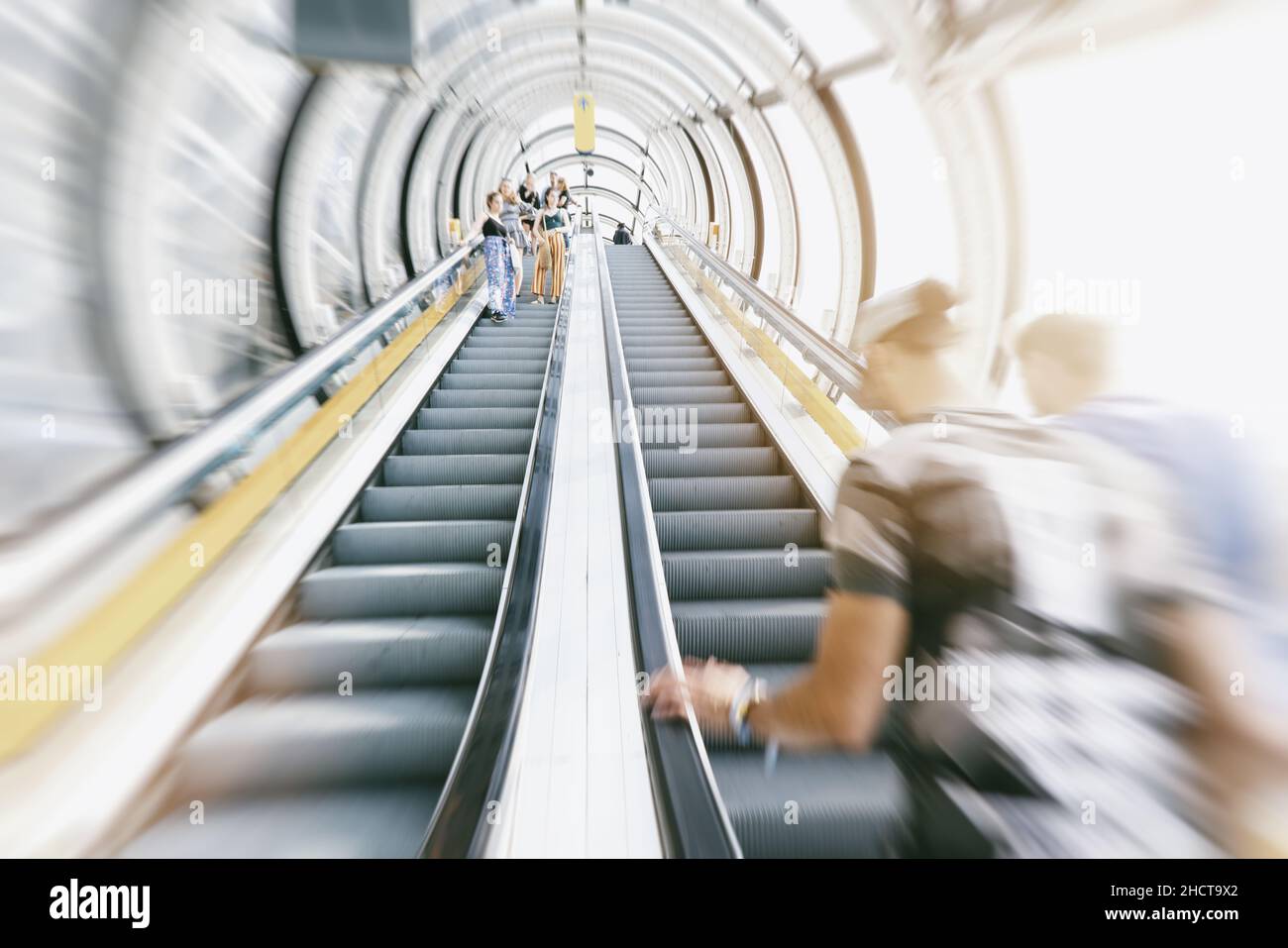 anonymous people rushing on a escalator Stock Photo - Alamy